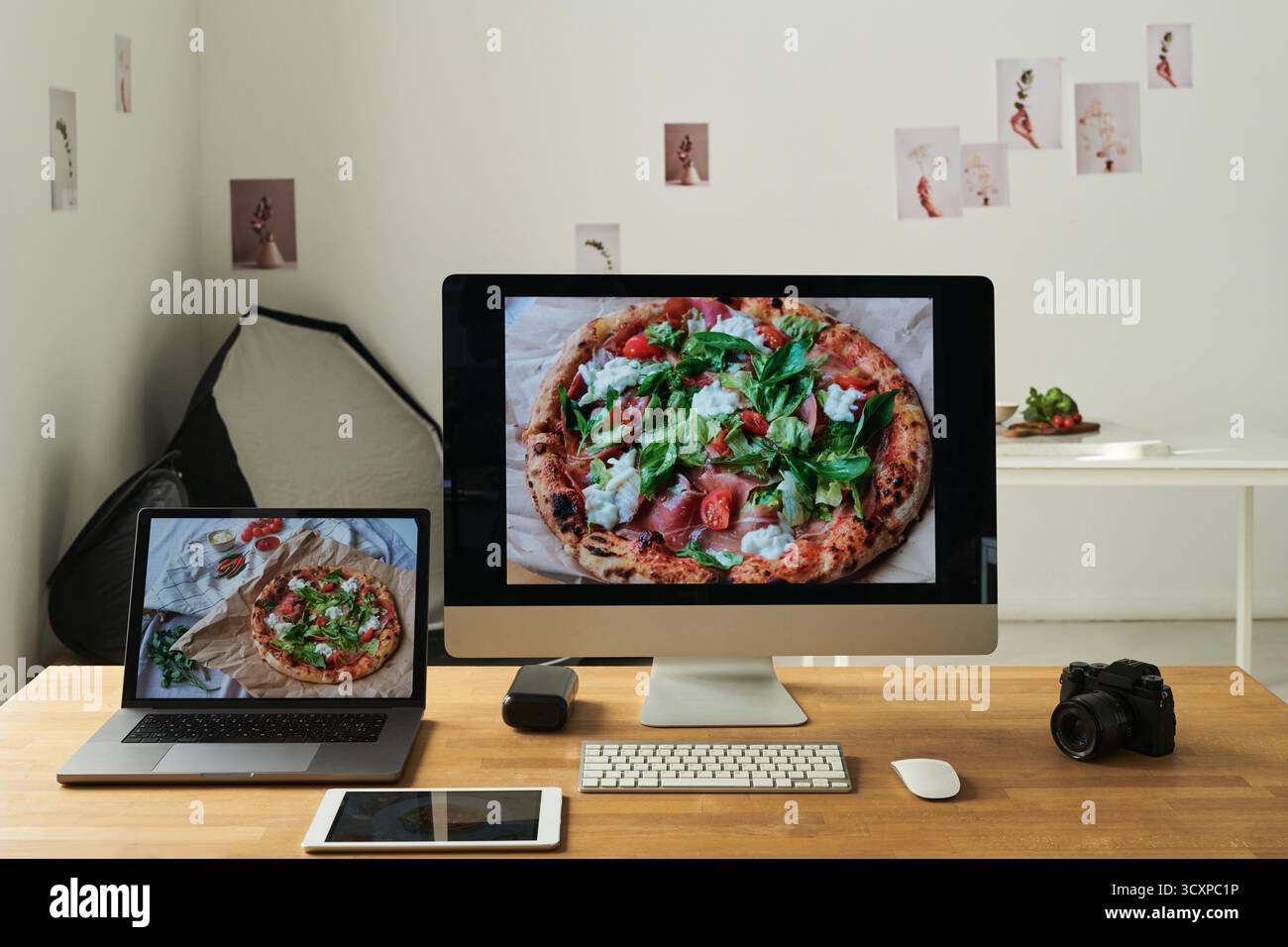 Modern Workspace Featuring Pizza Image Displayed on Computer and Laptop ...