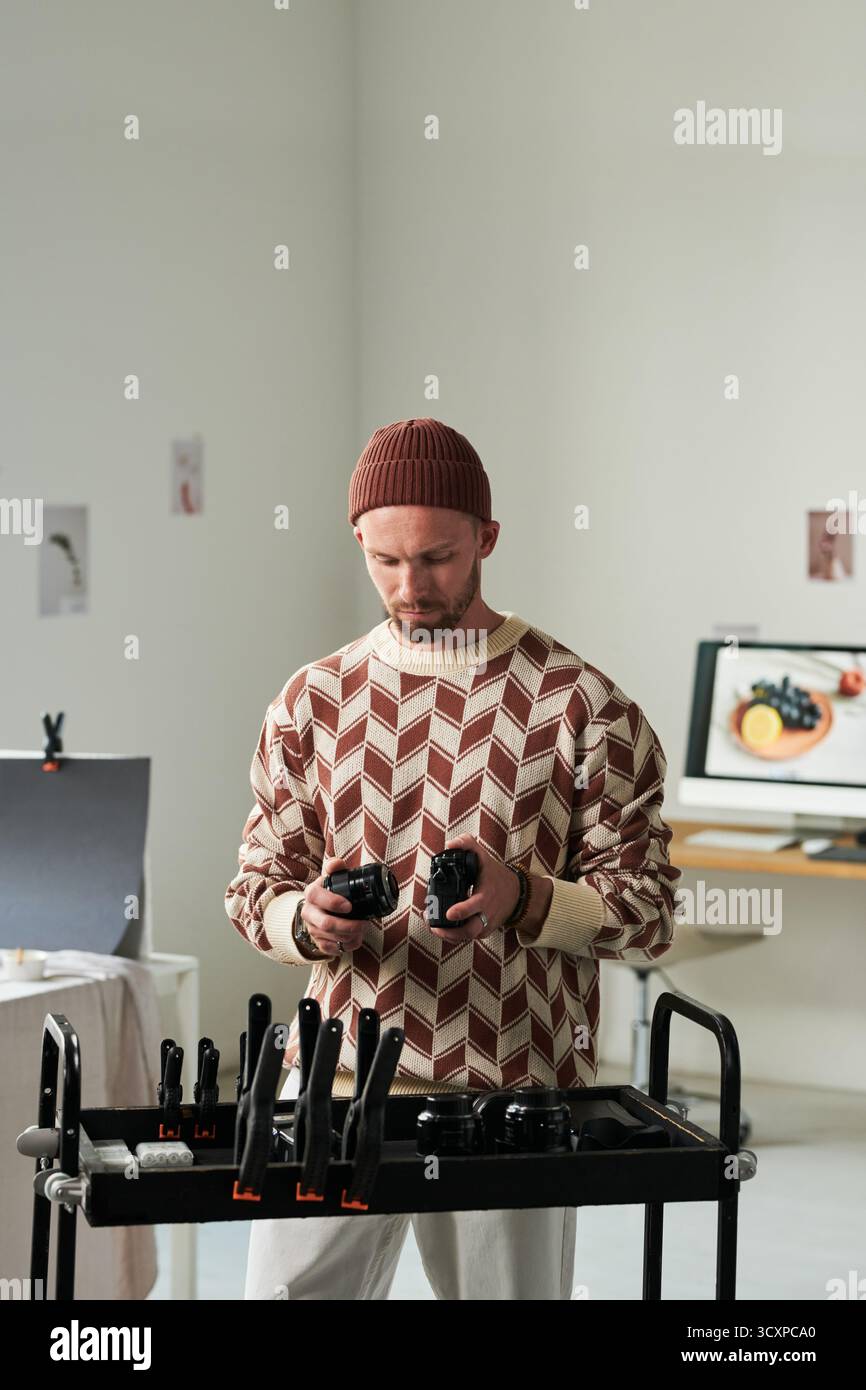 Young photographer preparing camera hi-res stock photography and images ...