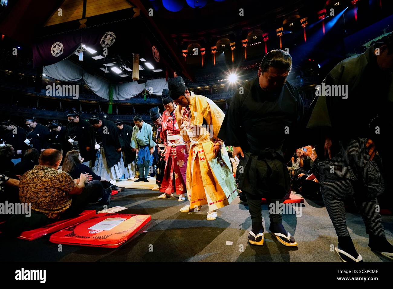 Officials bow during the opening ceremony ahead of day one of the Grand ...