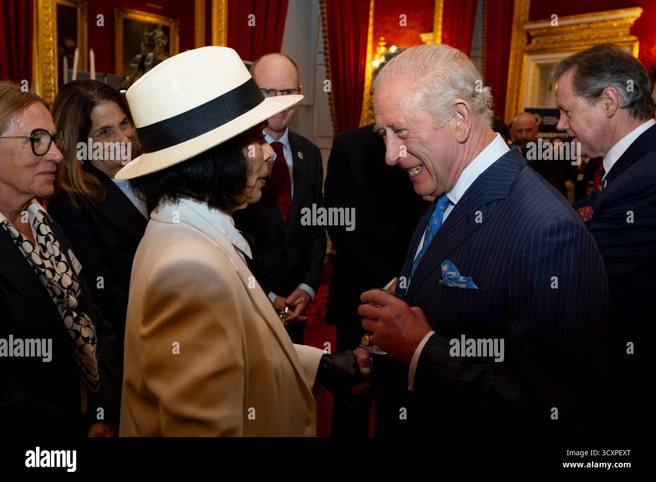 King Charles III greets Bianca Jagger during a reception for scientists ...
