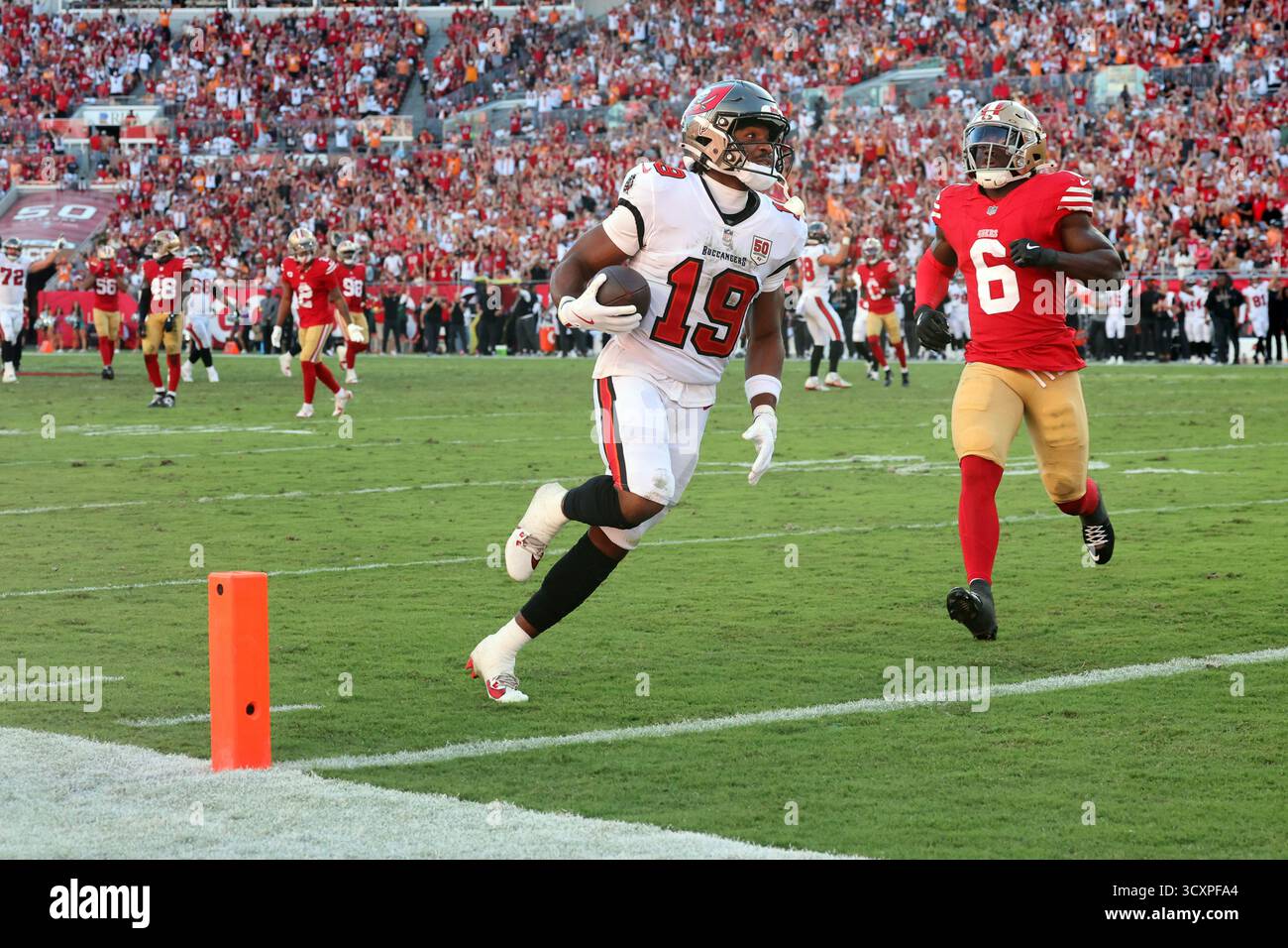 Tampa Bay Buccaneers wide receiver Kameron Johnson (19) scores a ...