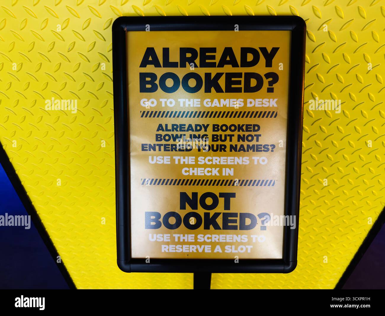 Manchester, UK - September 26, 2025: Bright yellow King Pins arcade ...