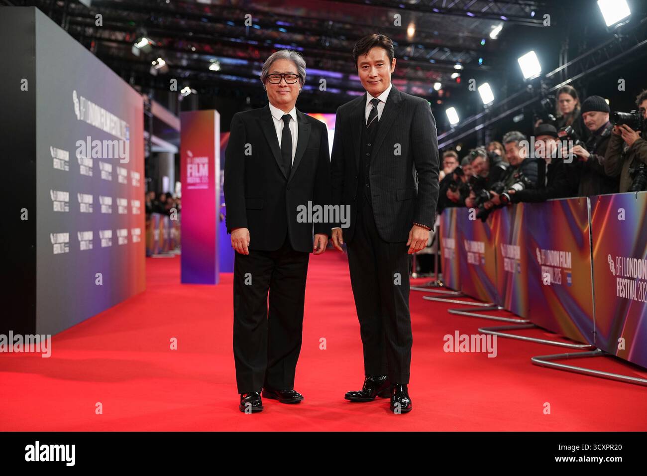 Director Chan-wook Park, left and Byung-hun Leek pose for photographers ...
