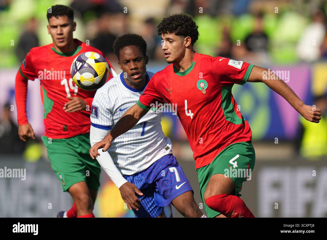 Morocco's Ismael Baouf (4) and France's Lucas Michal vie for the ball ...