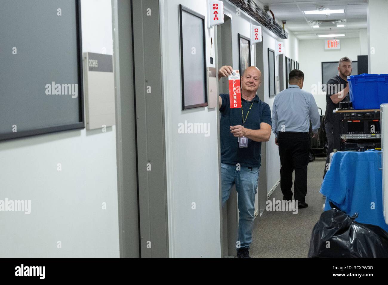 Neil Wallace signals that the Fox News staff has cleared the contents ...