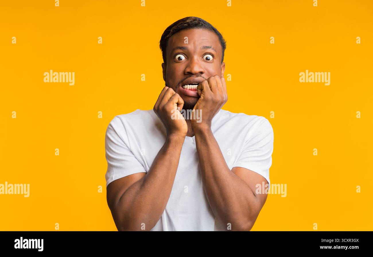Scared African American Guy Touching Face Posing On Yellow Background ...