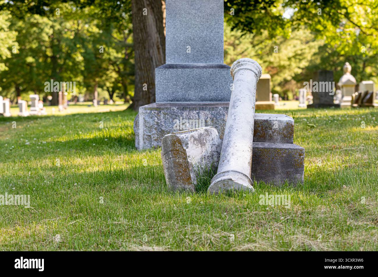 Graveyard headstone broken and damaged. Cemetery maintenance, grave ...