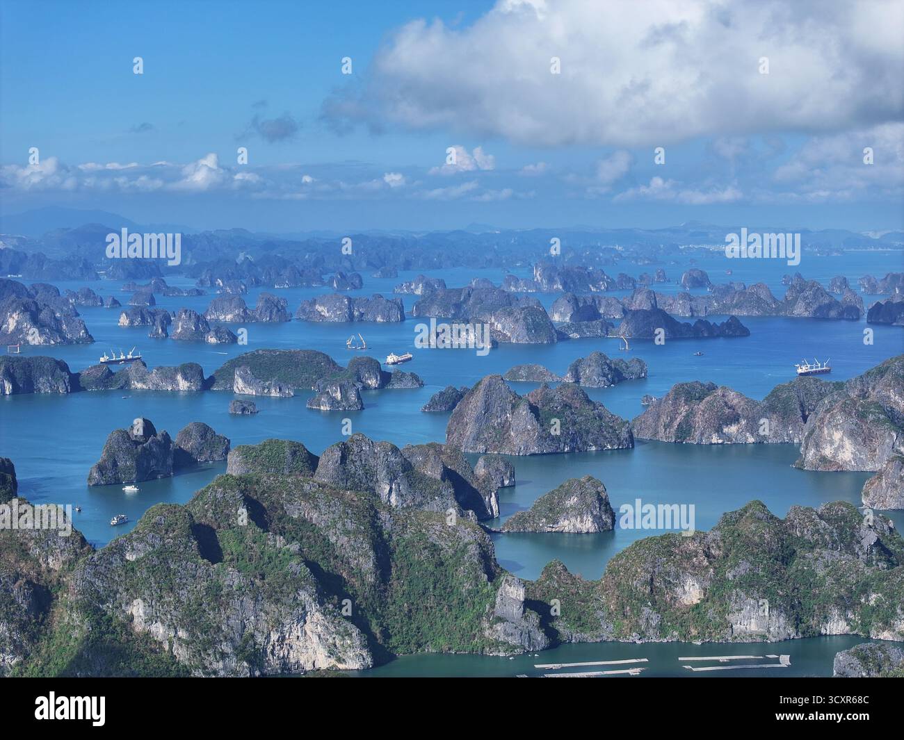 Ha long bay showing limestone karst formations rising from the emerald ...
