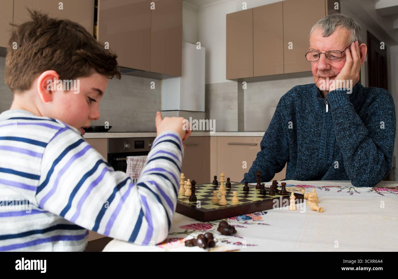 Grandfather and Grandson Playing Chess – Generational Bond and Family ...