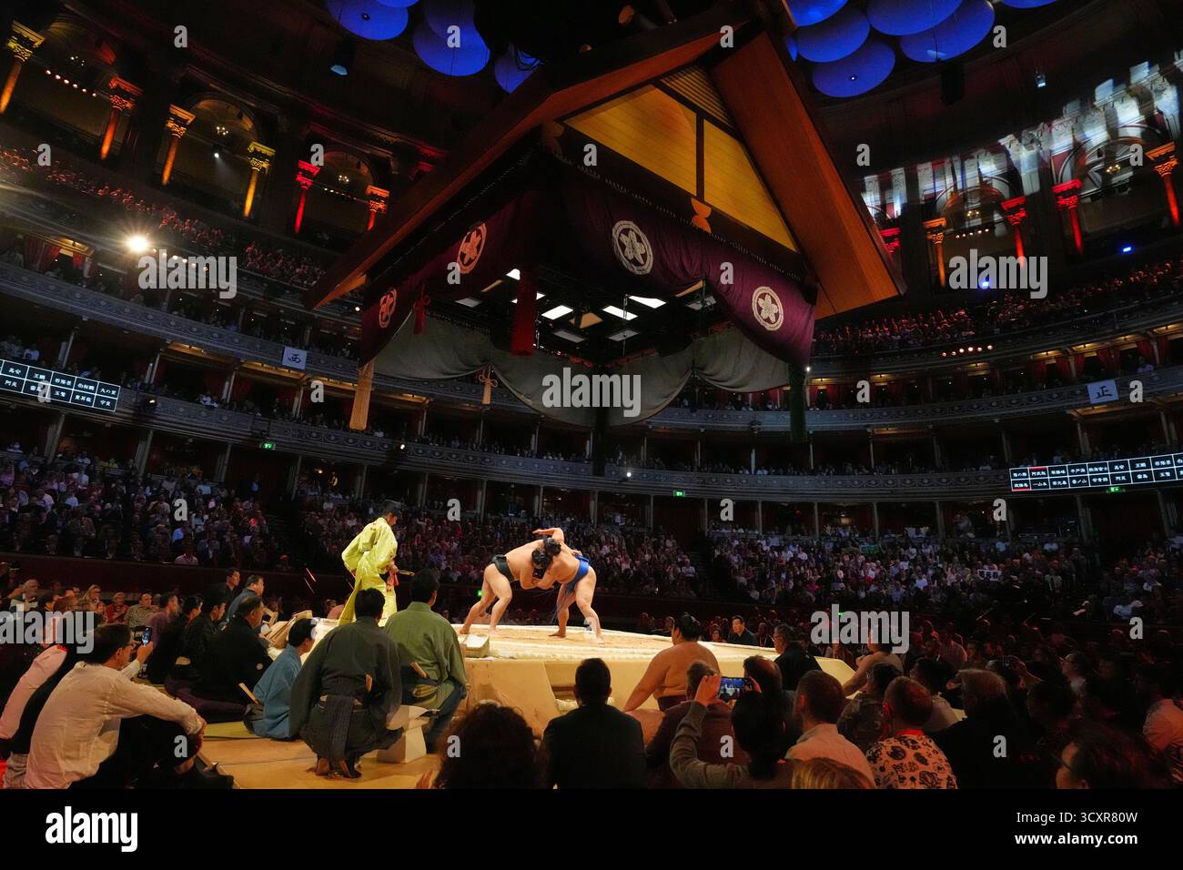 Sumo wrestlers battle during The Grand Sumo Tournament at the Royal ...