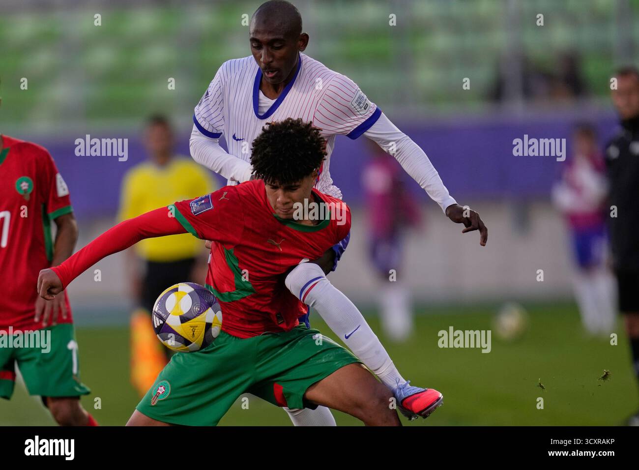 France's Tadjidine Mmadi, back, and Morocco's Taha Majni battle for the ...