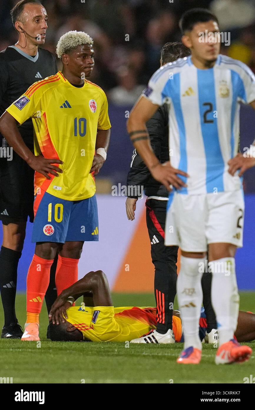 Colombia's Oscar Perea gestures after teammate Joel Canchimbo, bottom ...