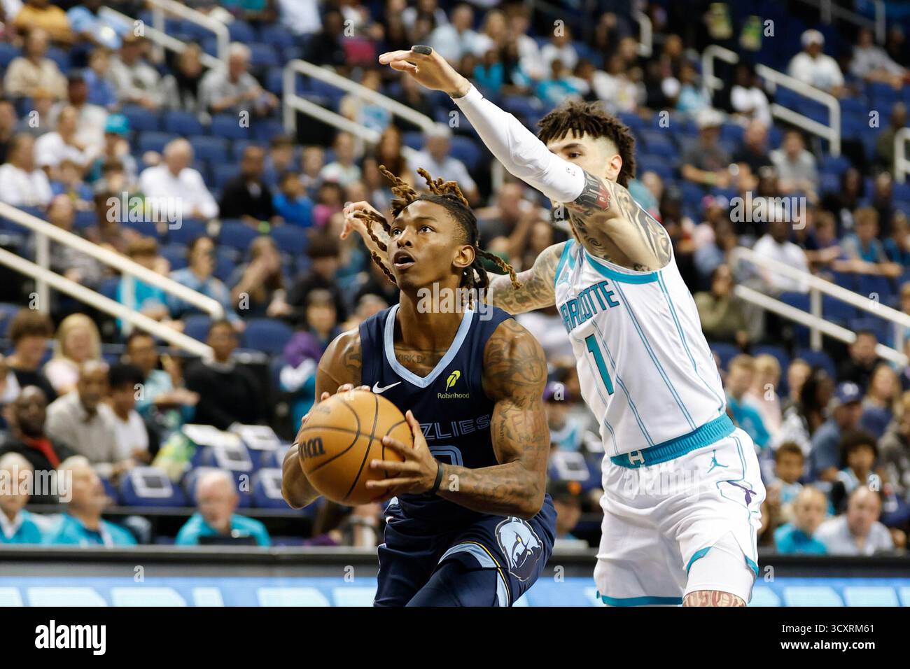 Memphis Grizzlies guard Javon Small, left, drives to the basket ahead ...