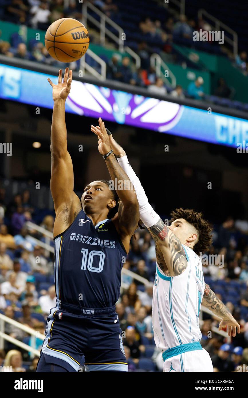 Memphis Grizzlies guard Javon Small, left, shoots against Charlotte ...