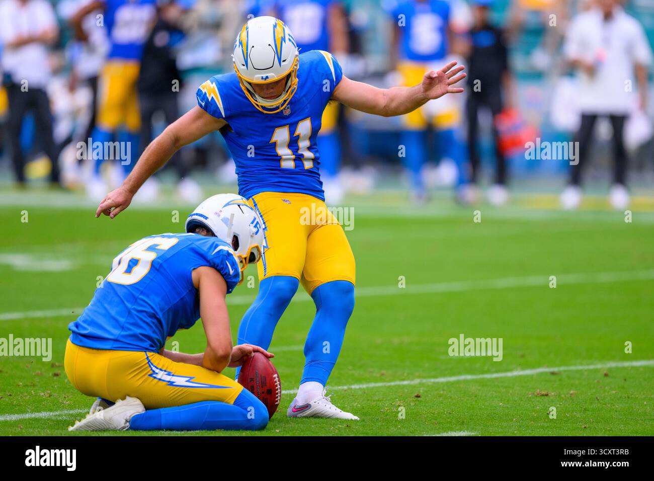 Los Angeles Chargers punter JK Scott (16) holds the ball as kicker ...
