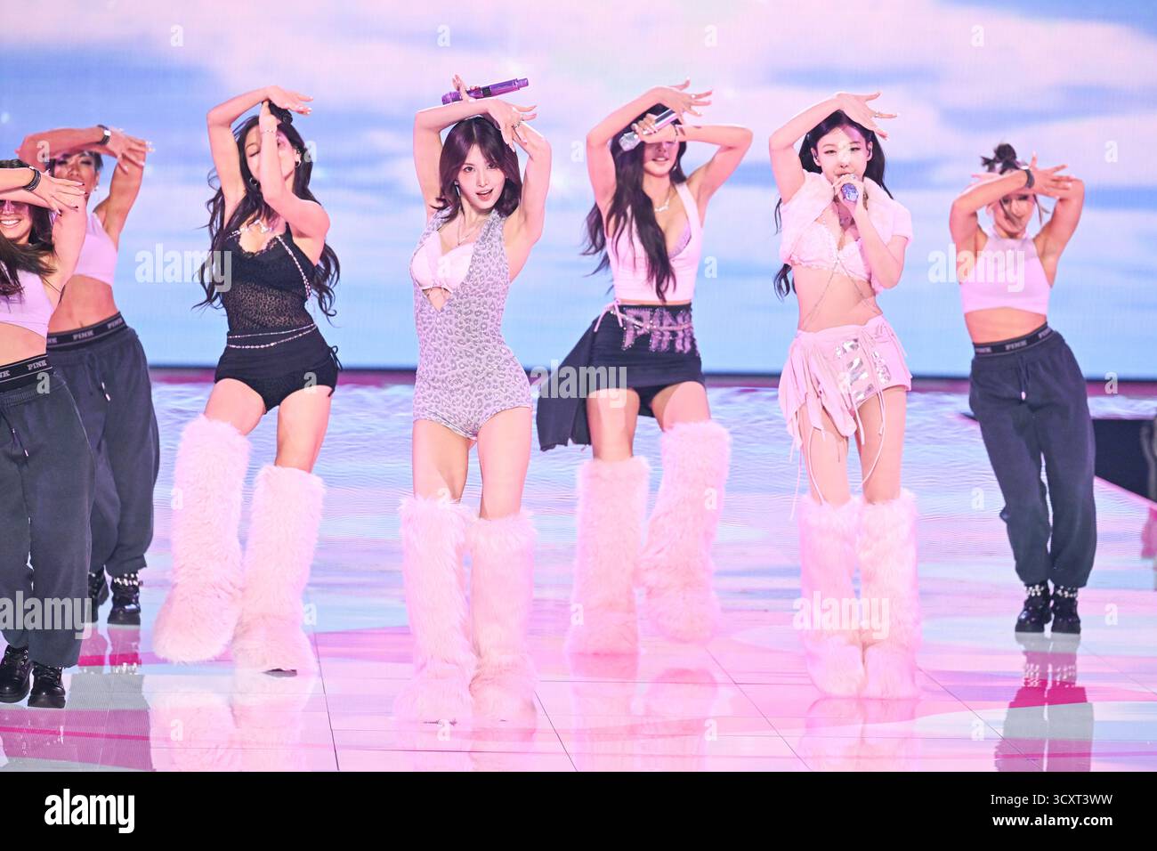 Jihyo, from left, Momo, Tzuyu, and Nayeon of TWICE perform during the ...