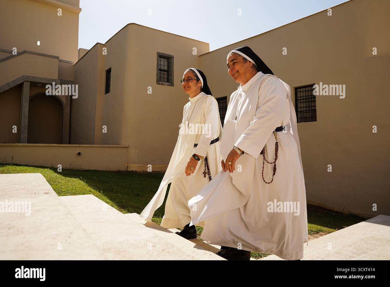 Nuns walk at St. Thomas Syriac Orthodox Church during its reopening ...