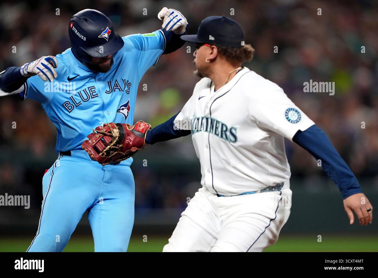 Toronto Blue Jays' Nathan Lukes, left, is tagged out by Seattle ...