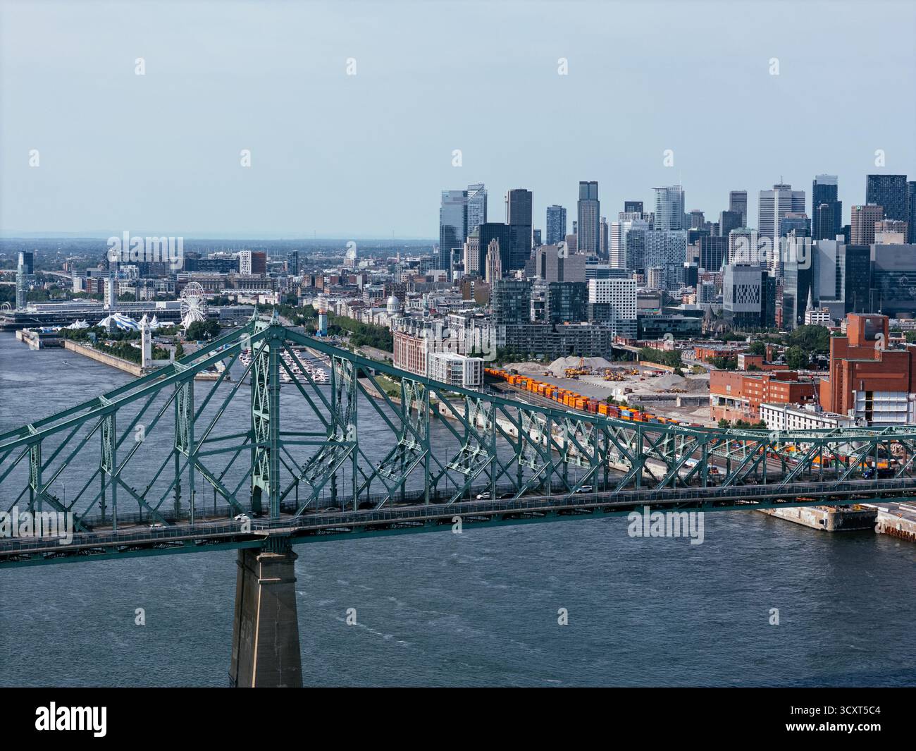 Aerial view of Montreal city skyline and the Jacques Cartier Bridge over the St. Lawrence. g ...