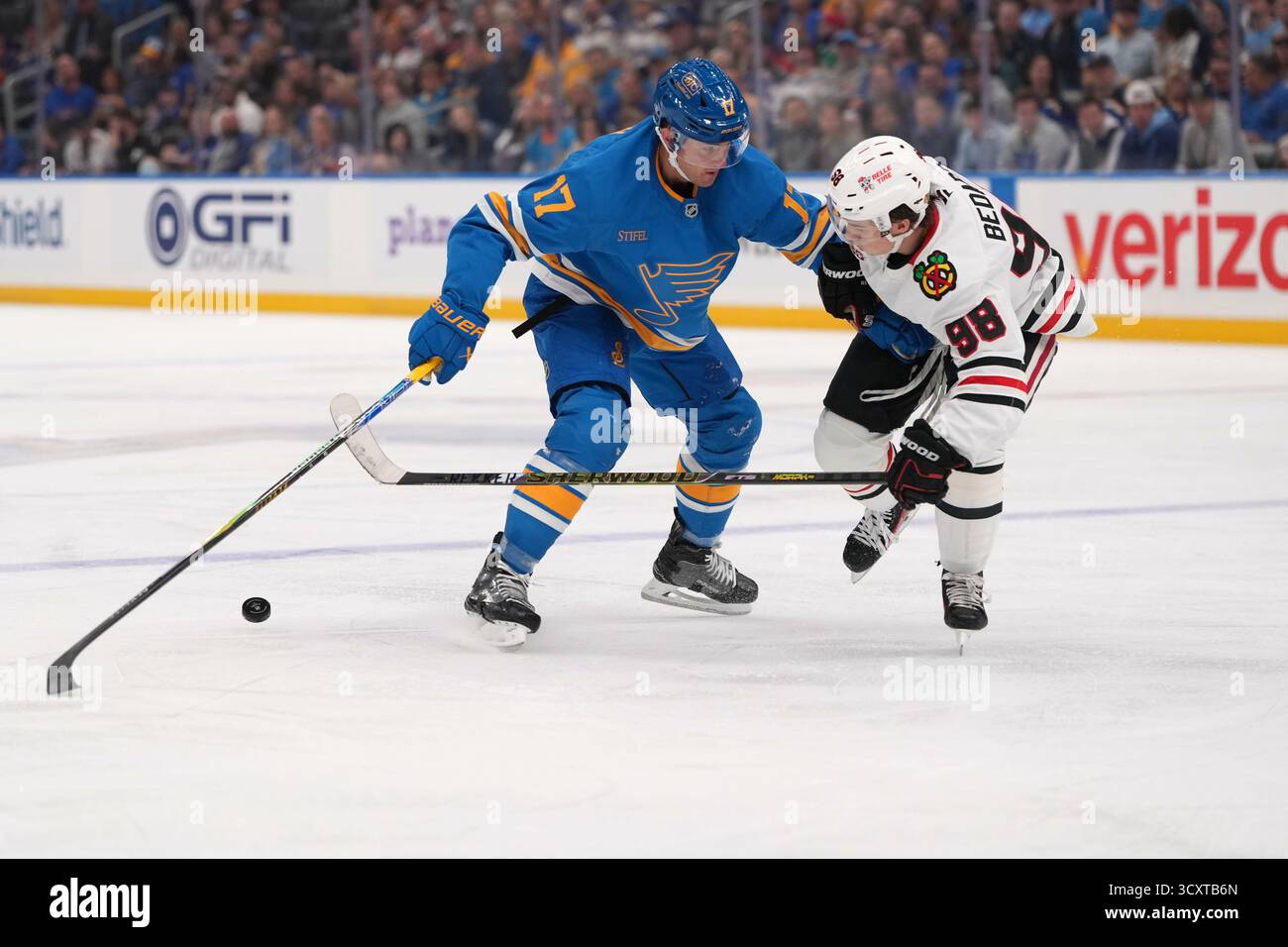 St. Louis Blues' Cam Fowler (17) and Chicago Blackhawks' Connor Bedard ...