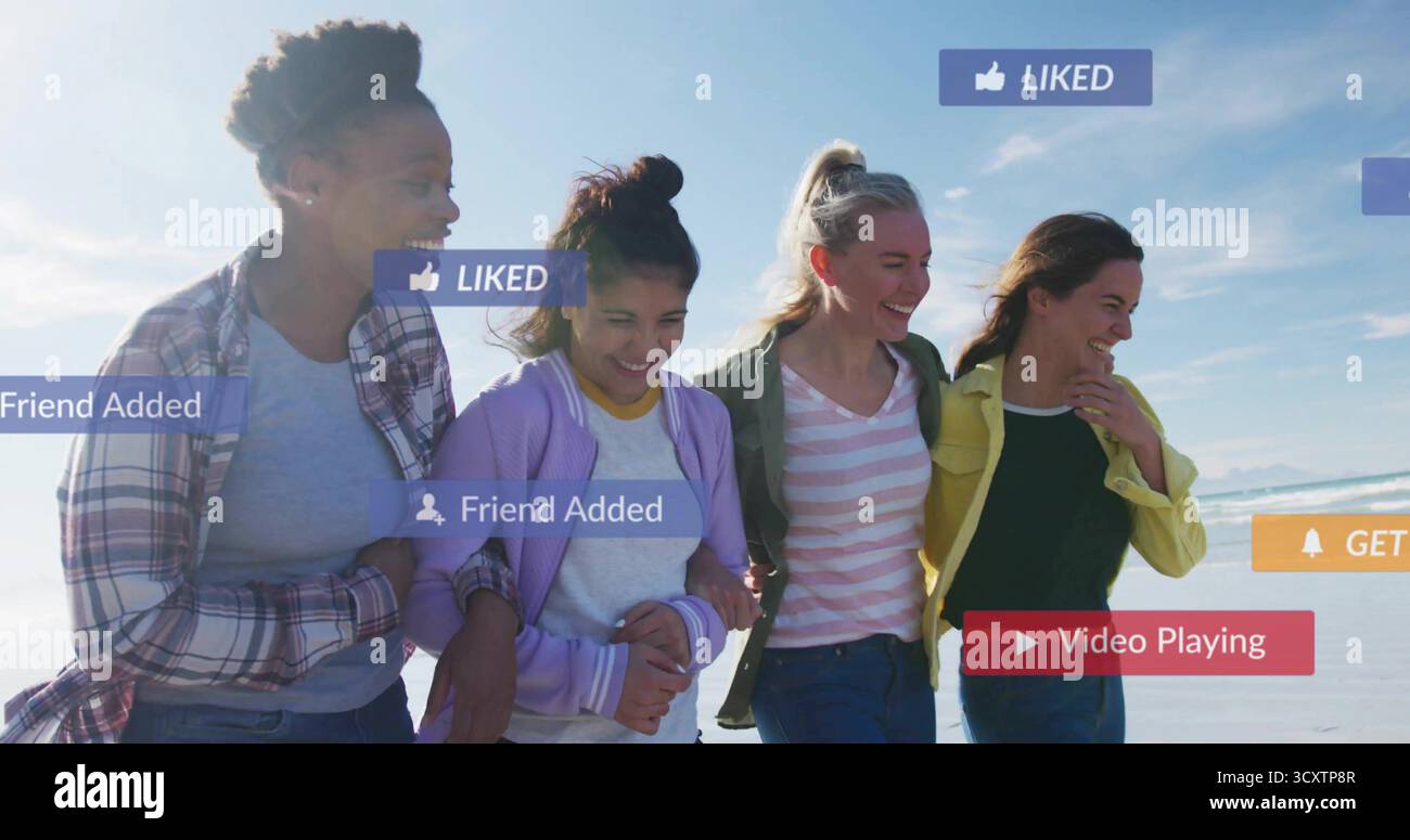 Four friends strolling arm in arm on sandy beach, with Liked Friend ...