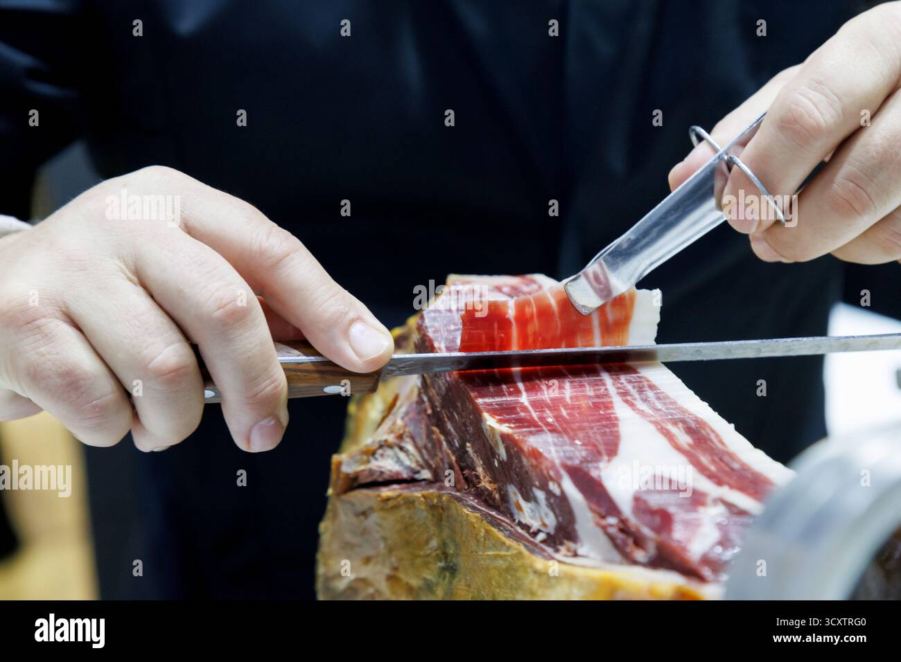 Professional chef slicing iberico hi-res stock photography and images ...