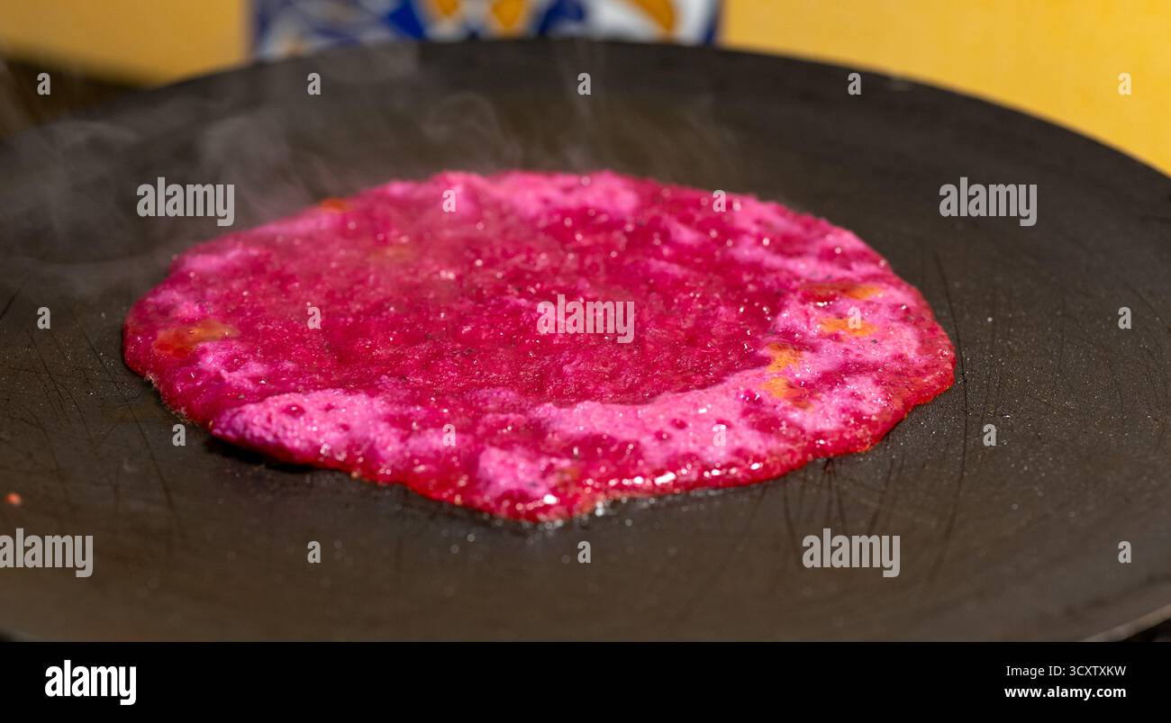 Hot beetroot pancake on a tawa or a flat pan Stock Photo - Alamy