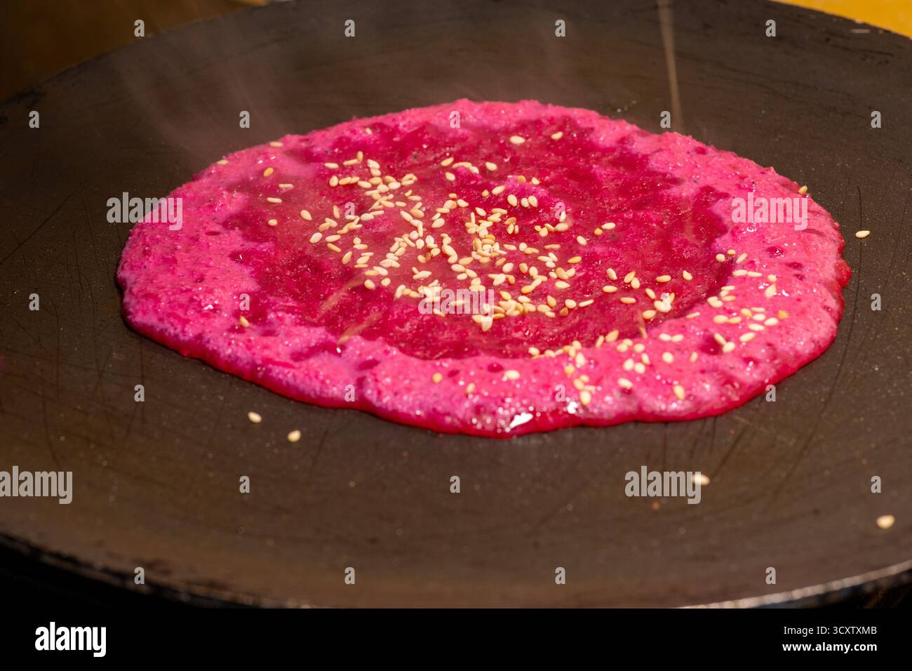 Hot beetroot pancake with sesame seeds on a tawa or a flat pan Stock ...