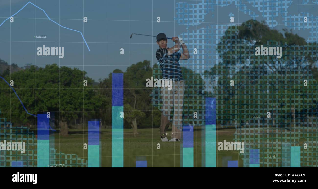 Swinging male golfer in golf attire on fairway, holding golf club with ...
