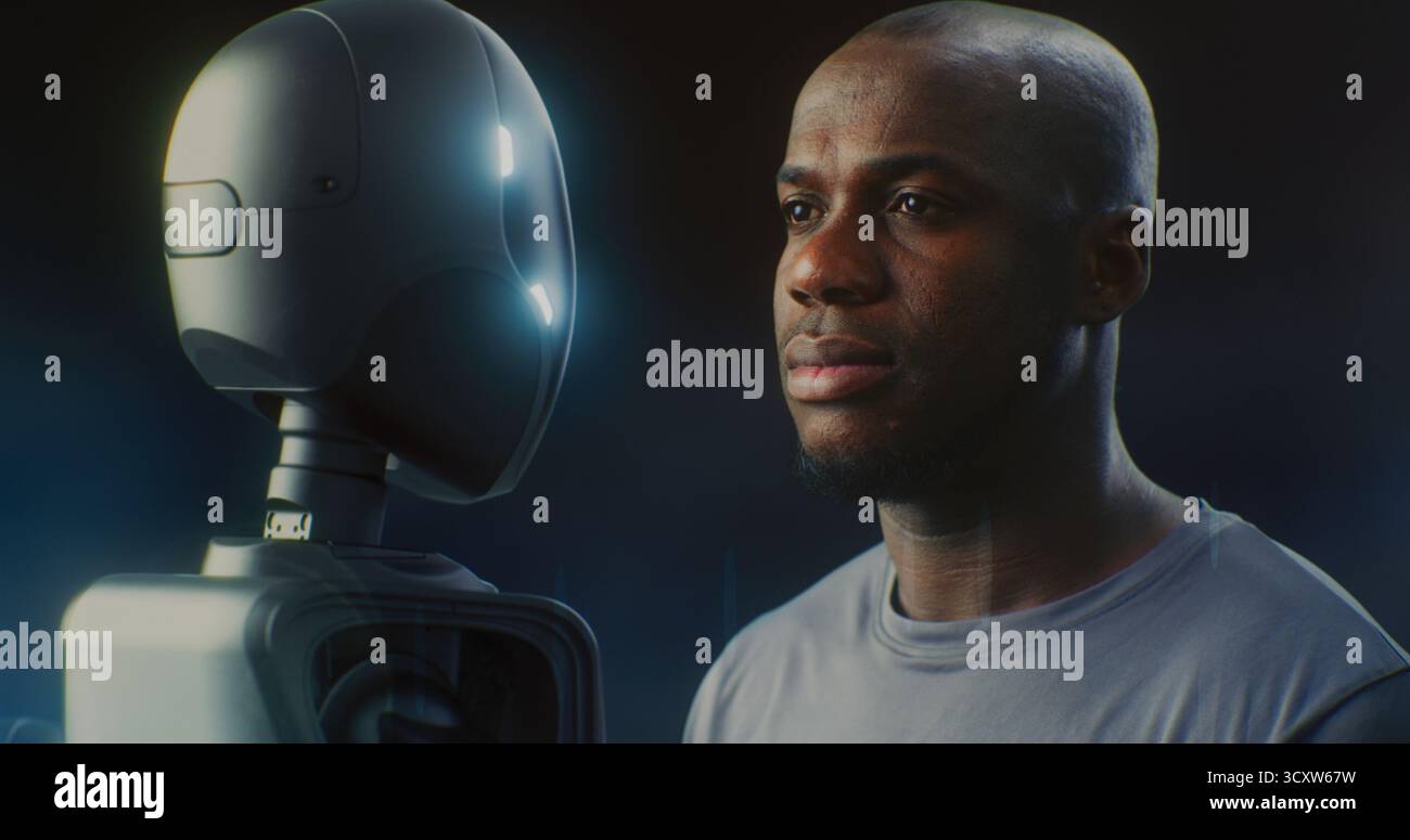 Close Up Man's Face Next Sleek, Dark Robot, Both Gazing With Neutral ...