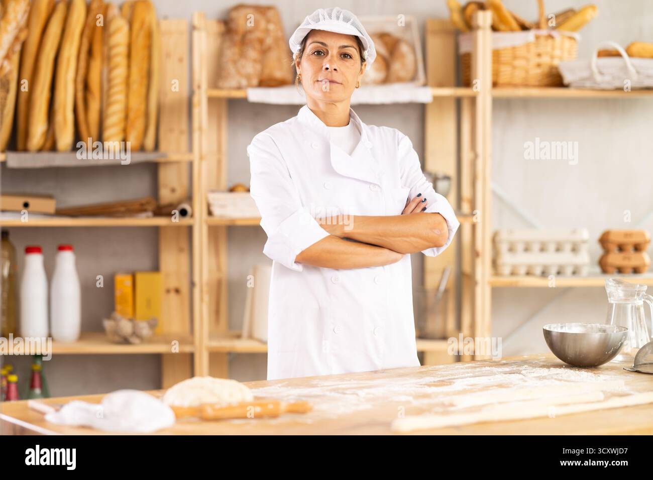 Mature woman baker posing hi-res stock photography and images - Alamy