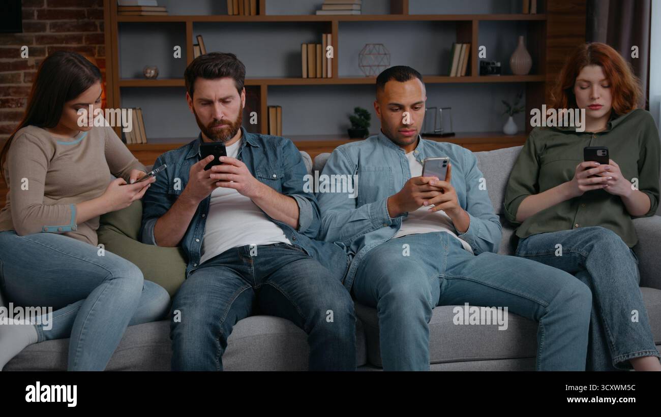 Focused four diverse friends overuse hi-res stock photography and ...