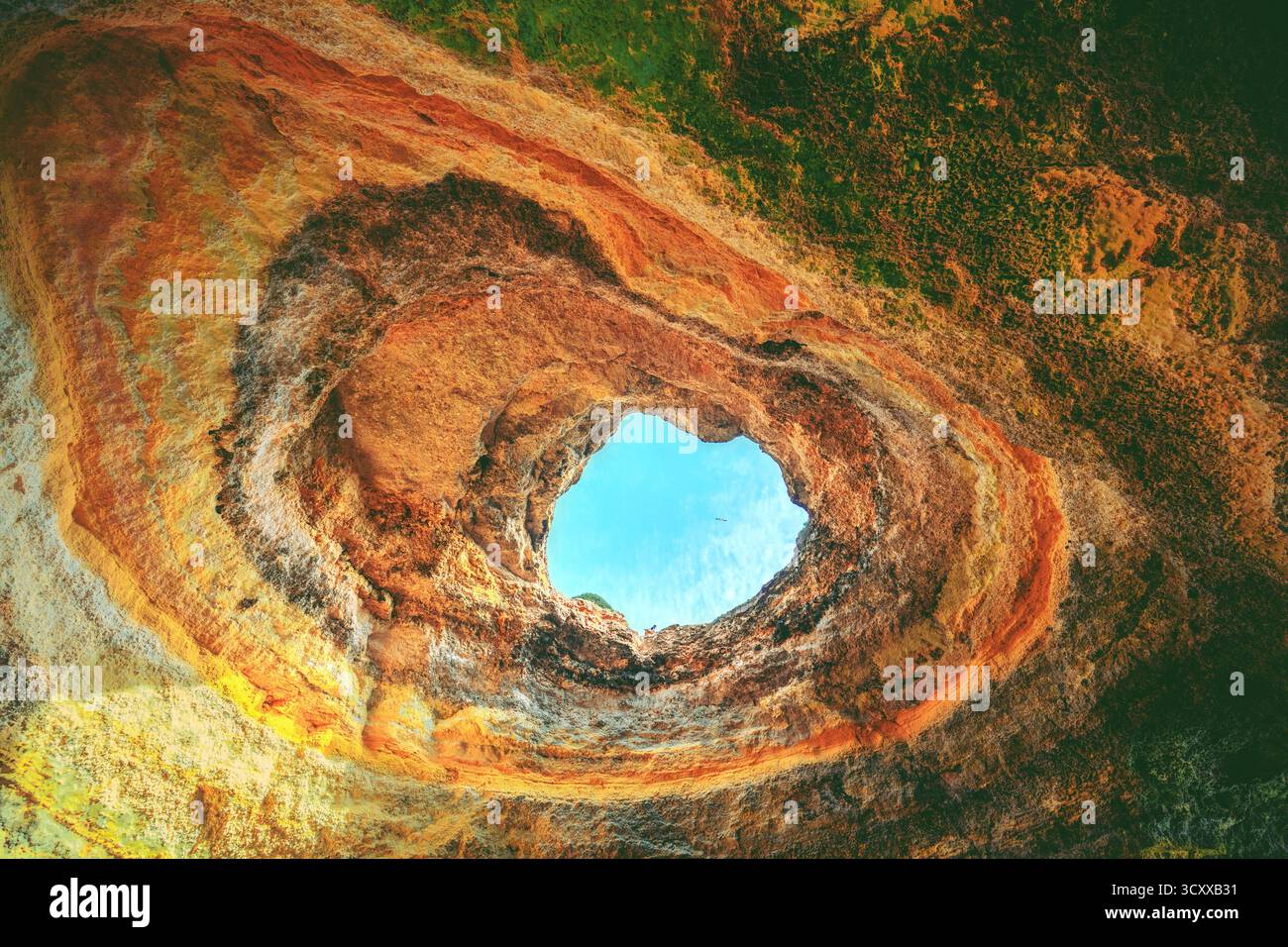 Coastal rocky seascape, view inside the cave Benagil in Algarve region ...