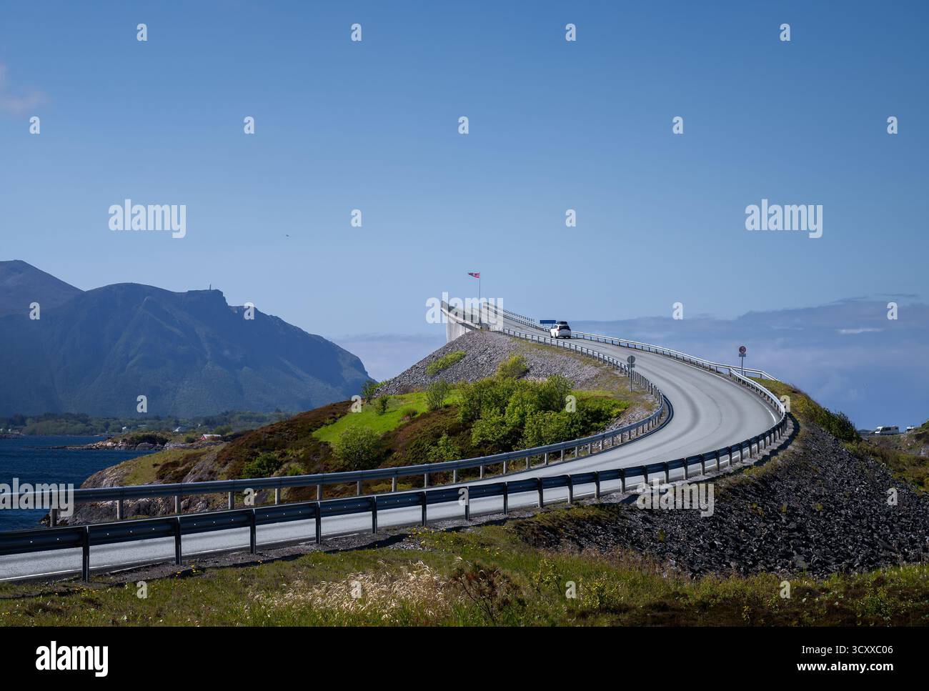 The curved bridge spans Norway’s scenic National Atlantic Ocean Road ...