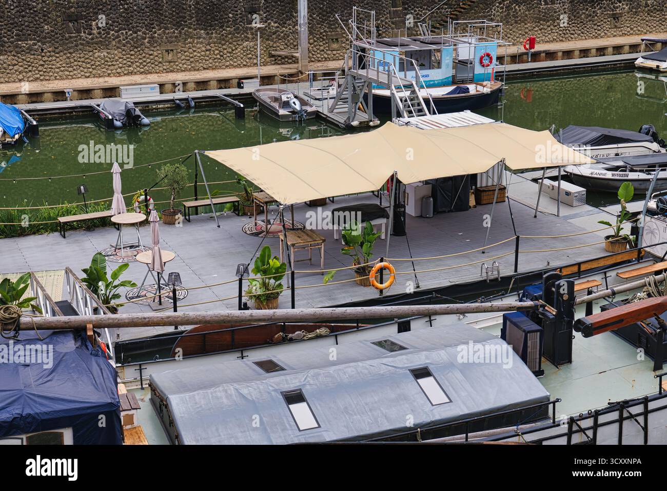 Outdoor Waterfront Terrace on Canal Dock with Beige Canopy Shade ...