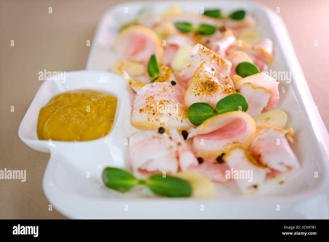 Thinly sliced pieces of frozen bacon with layers of meat and radish ...
