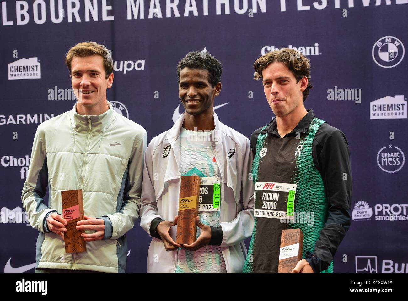 Nike Half Marathon men medalists (L-R) Toby Gualter, Haftu Strintzos ...