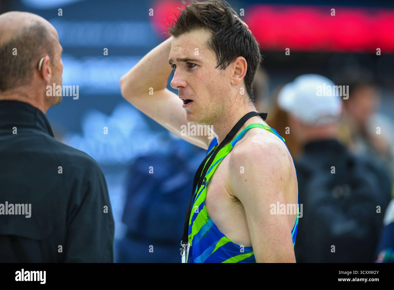 Bronze medal winner of half marathon Toby Gualter of New Zealand is ...