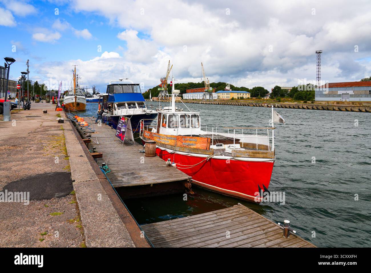 Sightseeing boat moored in the port of Liepaja on the west coast of ...