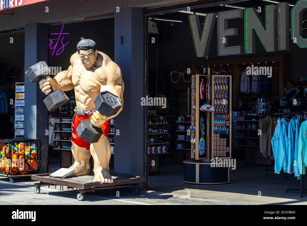 Statue of a bodybuilder lifting weights near Muscle Beach on the Venice ...