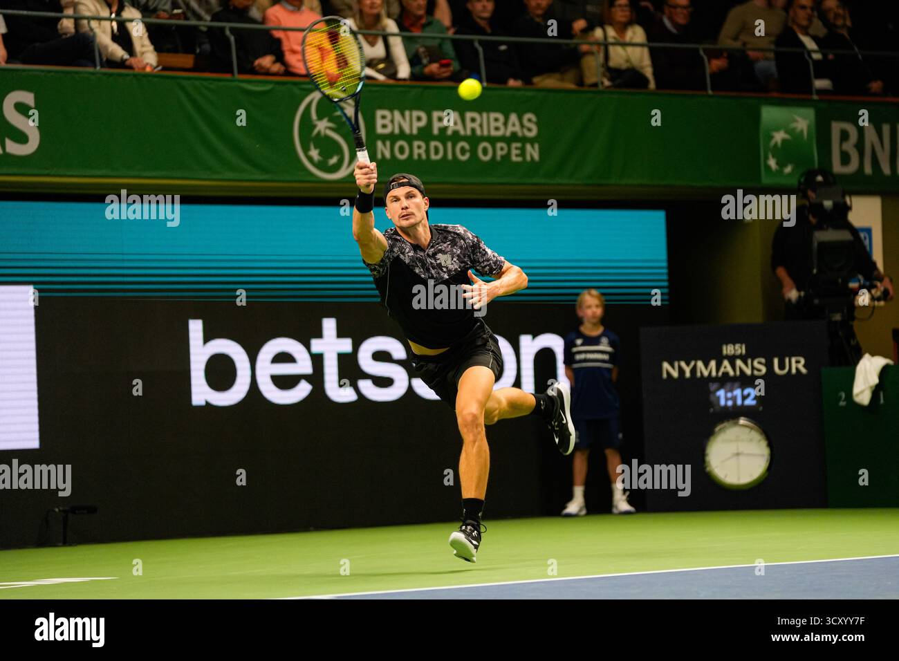 Danish tennis player Holger Rune in action against Marton Fucsovics of ...