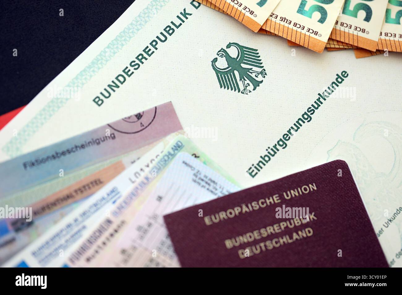 German passport and an identity card on an official naturalization ...