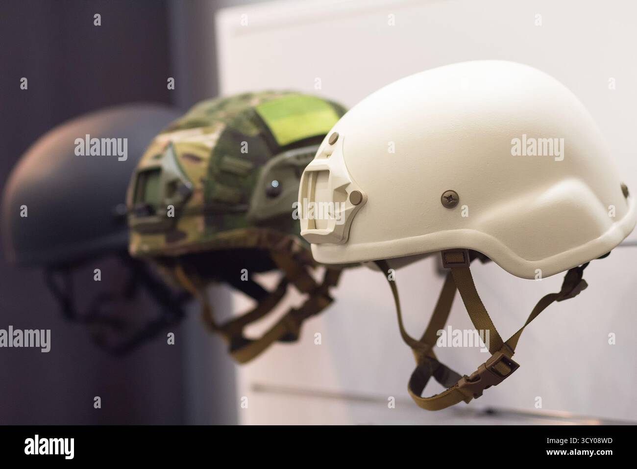 Modern tactical military helmets in showcase. Military market Stock ...