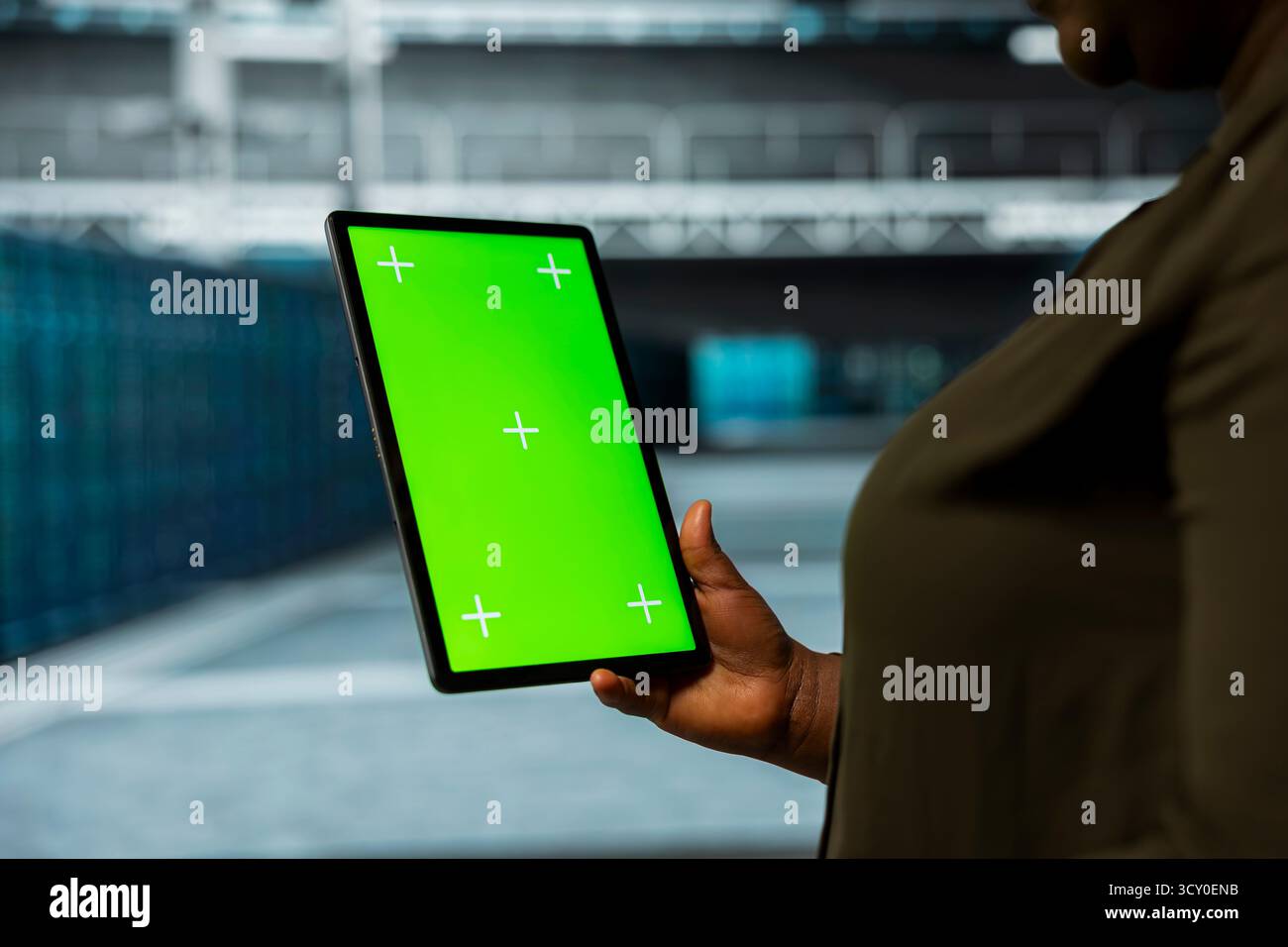 Data center technician using isolated screen tablet to automate anomaly ...