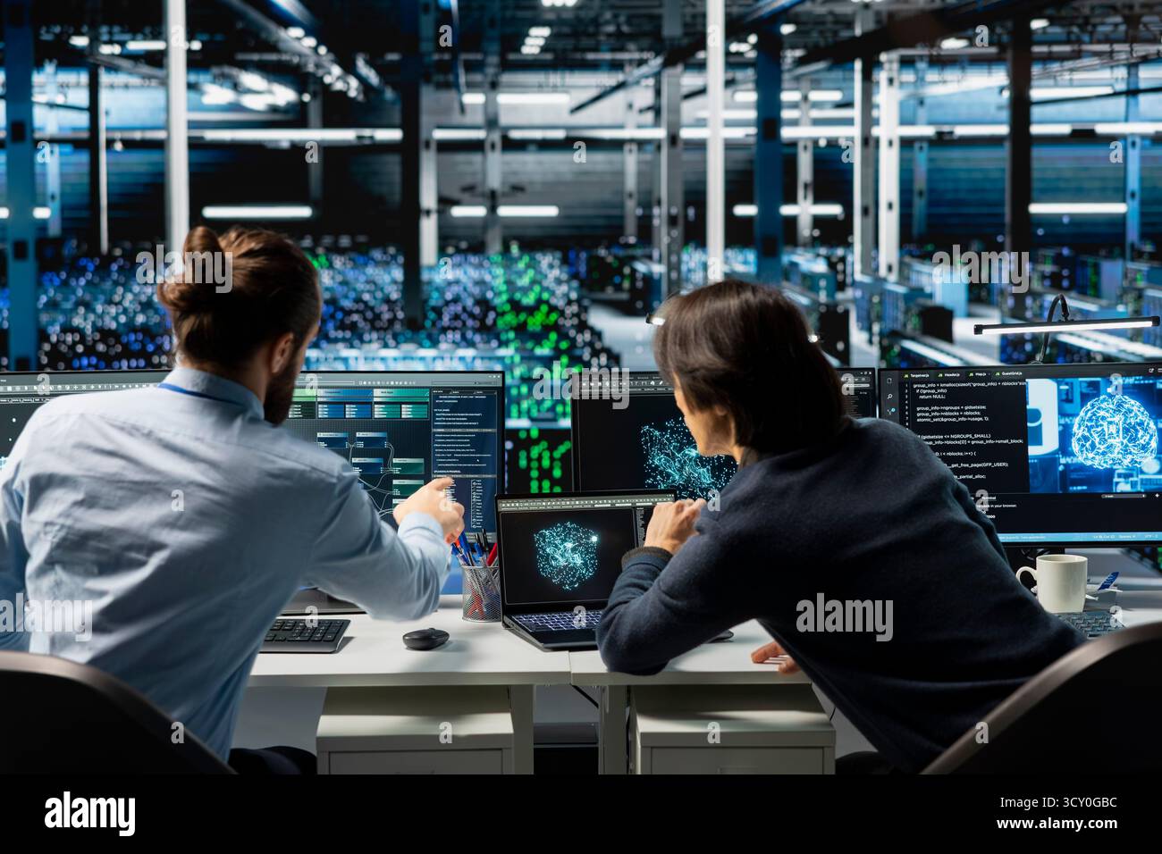 System administrators coding in data center, updating AI driven ...
