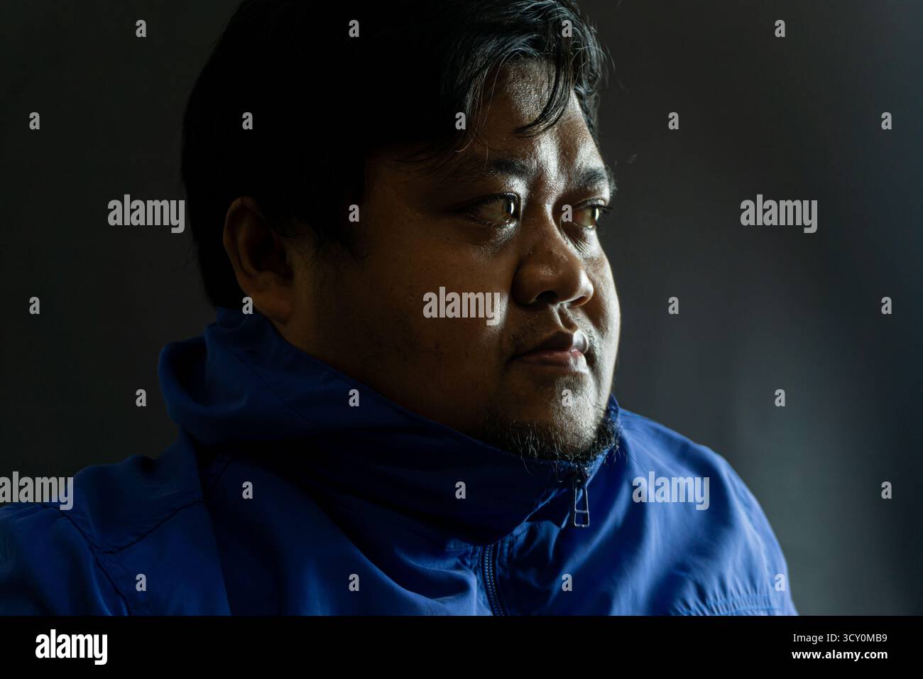Person wearing blue jacket hi-res stock photography and images - Alamy