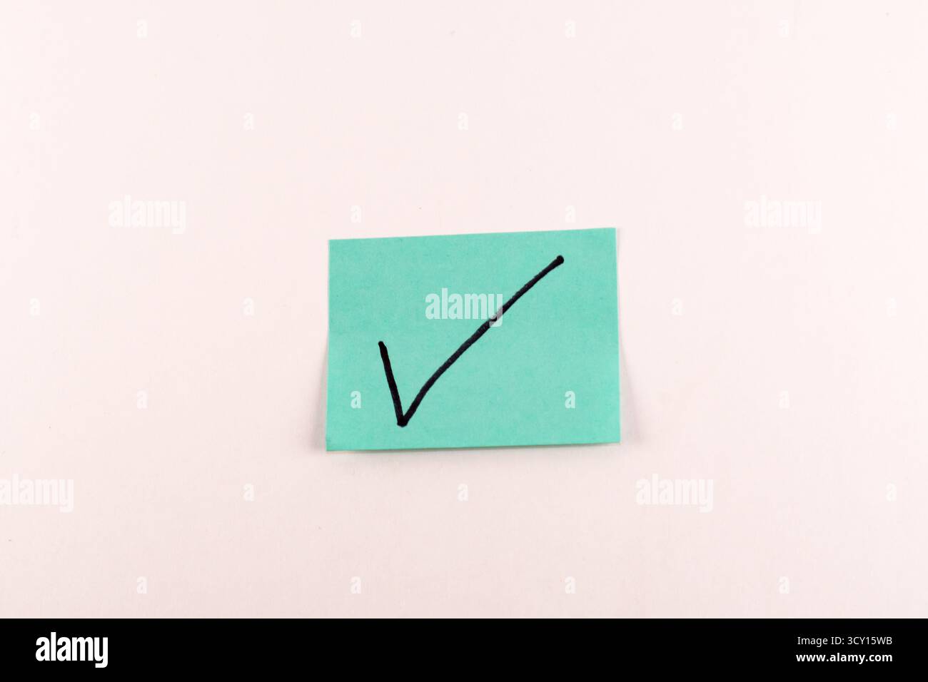 Turquoise Post-It Note With Bold Black Checkmark On White Background ...