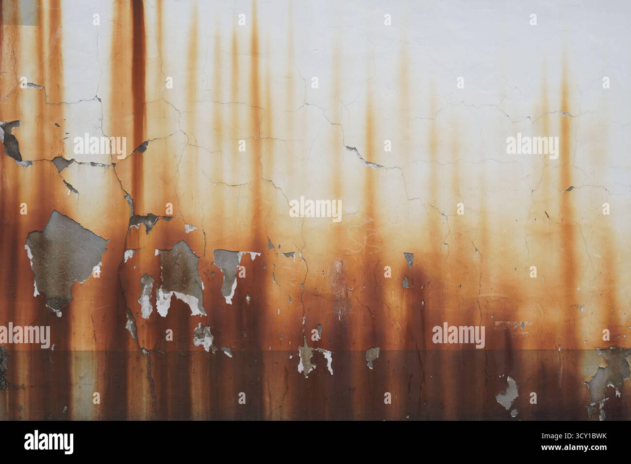 A weathered wall with peeling paint and rust stains Stock Photo - Alamy