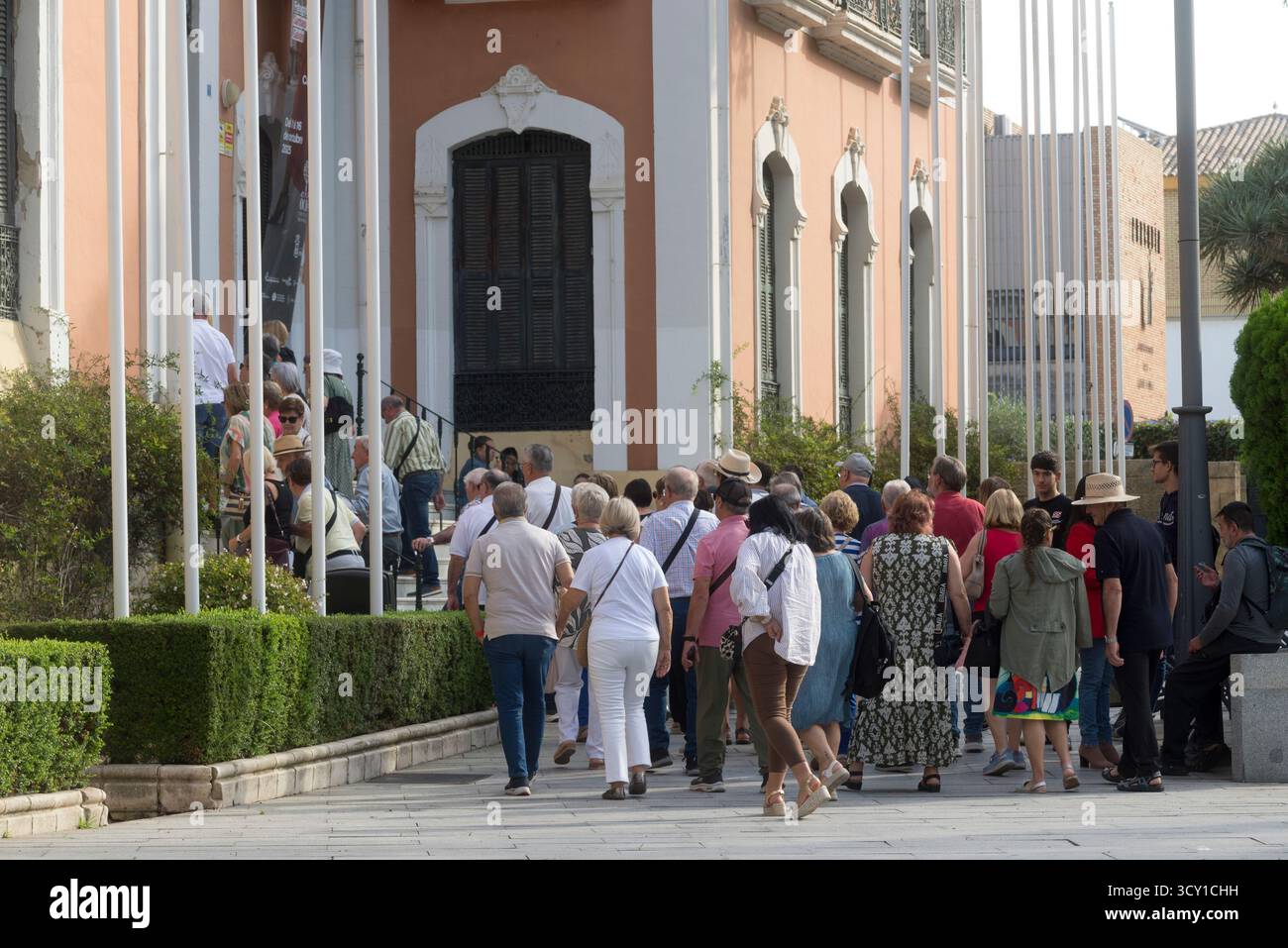 A group of tourists arriving at Casa Colon in Huelva, visiting the ...