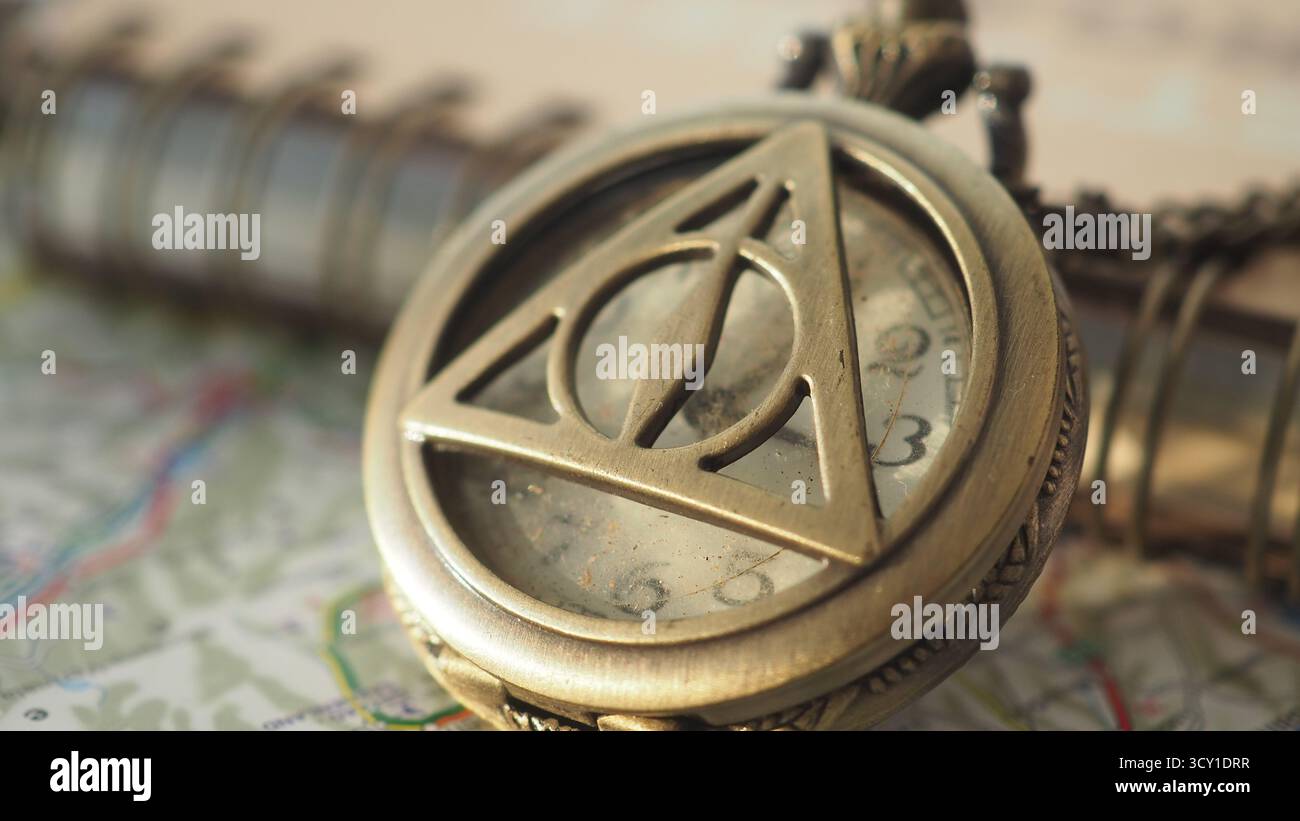 Vintage pocket watch rests on an old map with details Stock Photo - Alamy